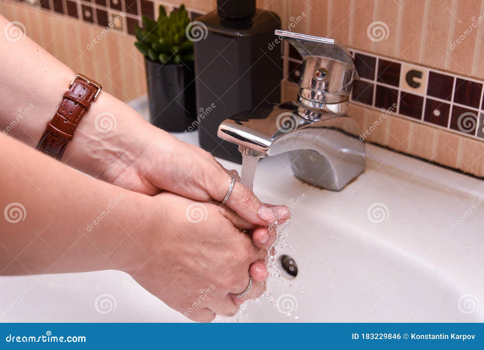 Washing of Hands with Soup Under Running the Water in the Bathroom ...