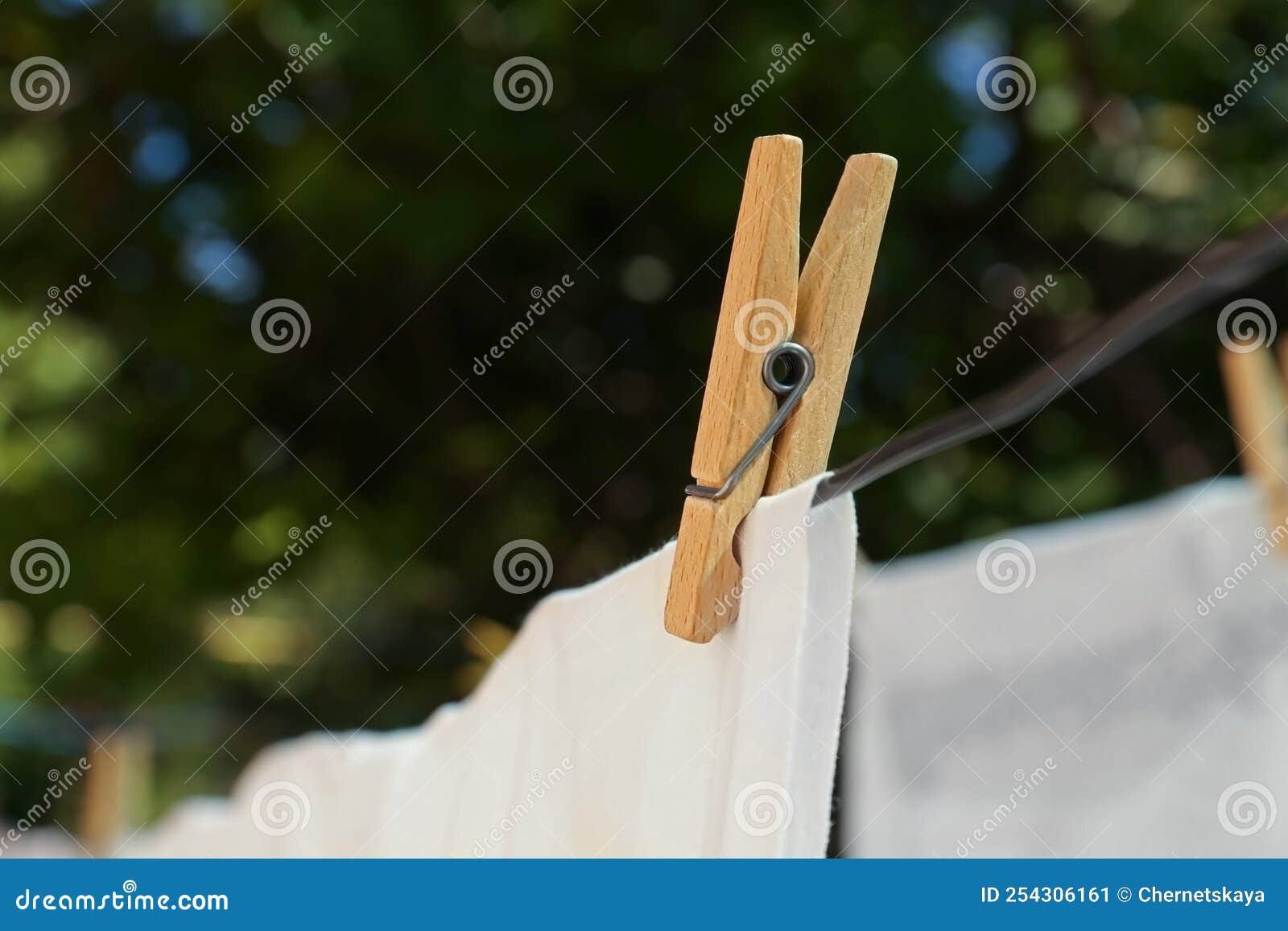 Washing Line with Clean Laundry and Clothespin Outdoors, Closeup Stock ...