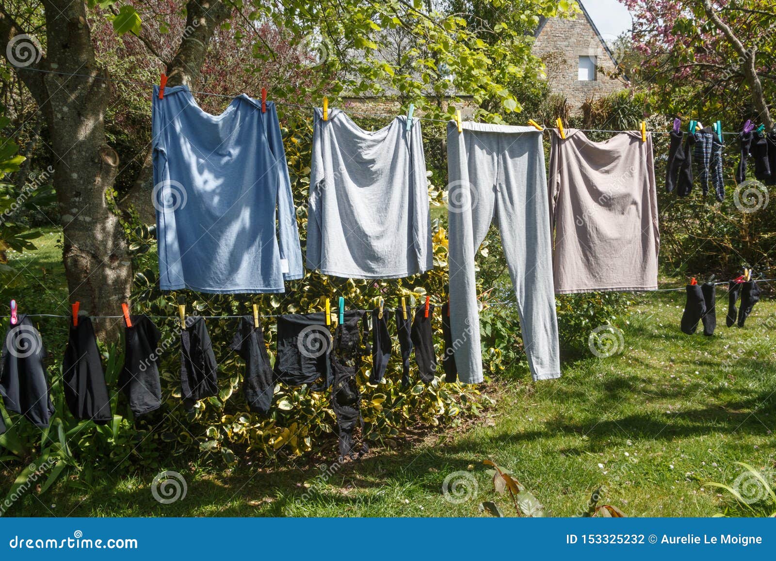 Washing line with clothes stock photo. Image of clothes - 153325232