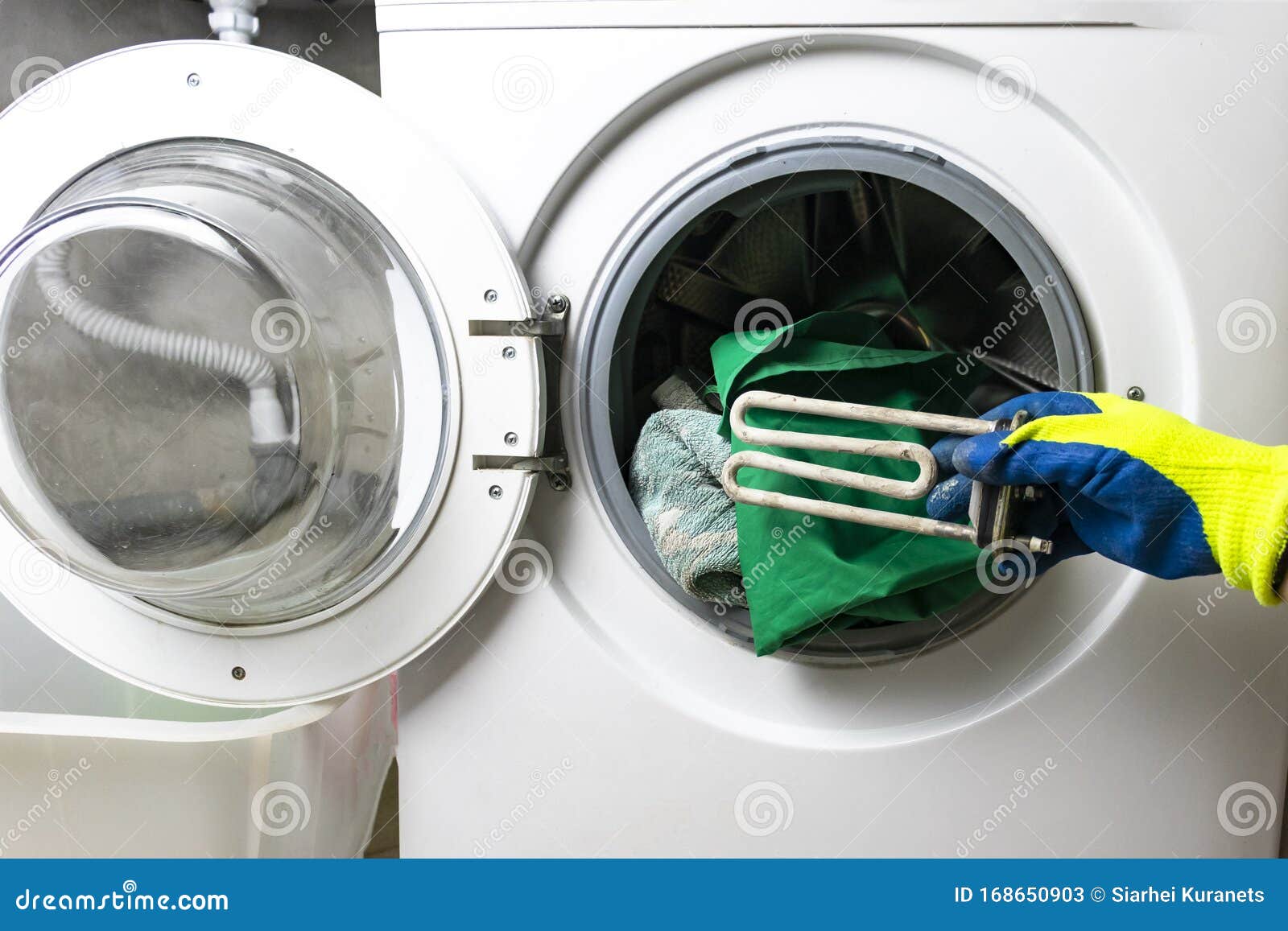 Washing Machine Breakdown. the Master Retrieves the Floor Part. in the ...