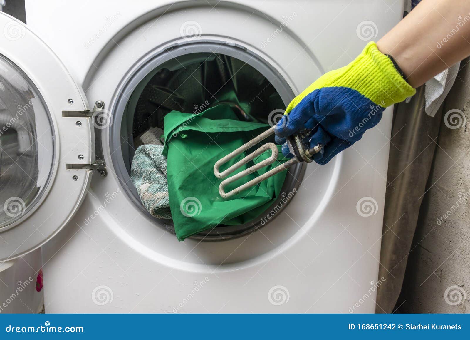 Washing Machine Breakdown. the Master Retrieves the Floor Part. in the ...