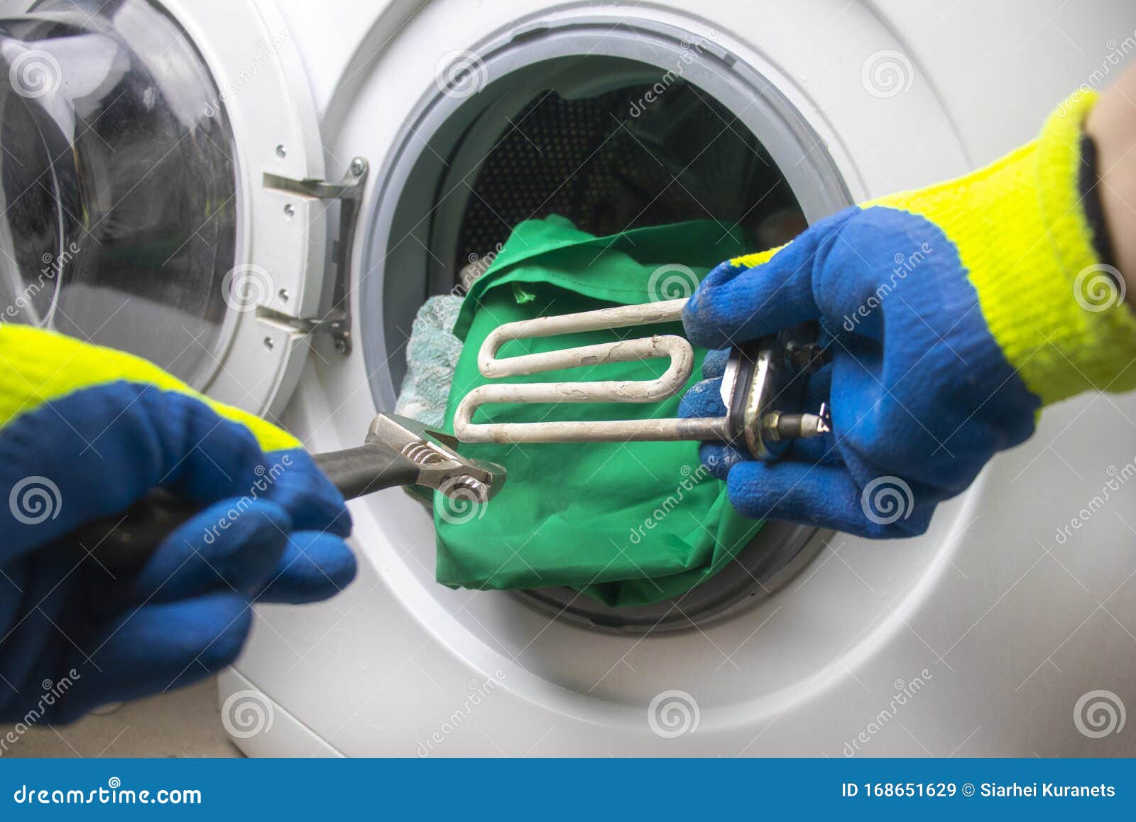 Washing Machine Breakdown. the Master Retrieves the Floor Part. in the ...