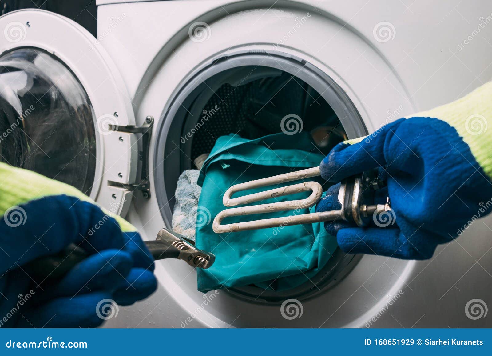 Washing Machine Breakdown. the Master Retrieves the Floor Part. in the ...
