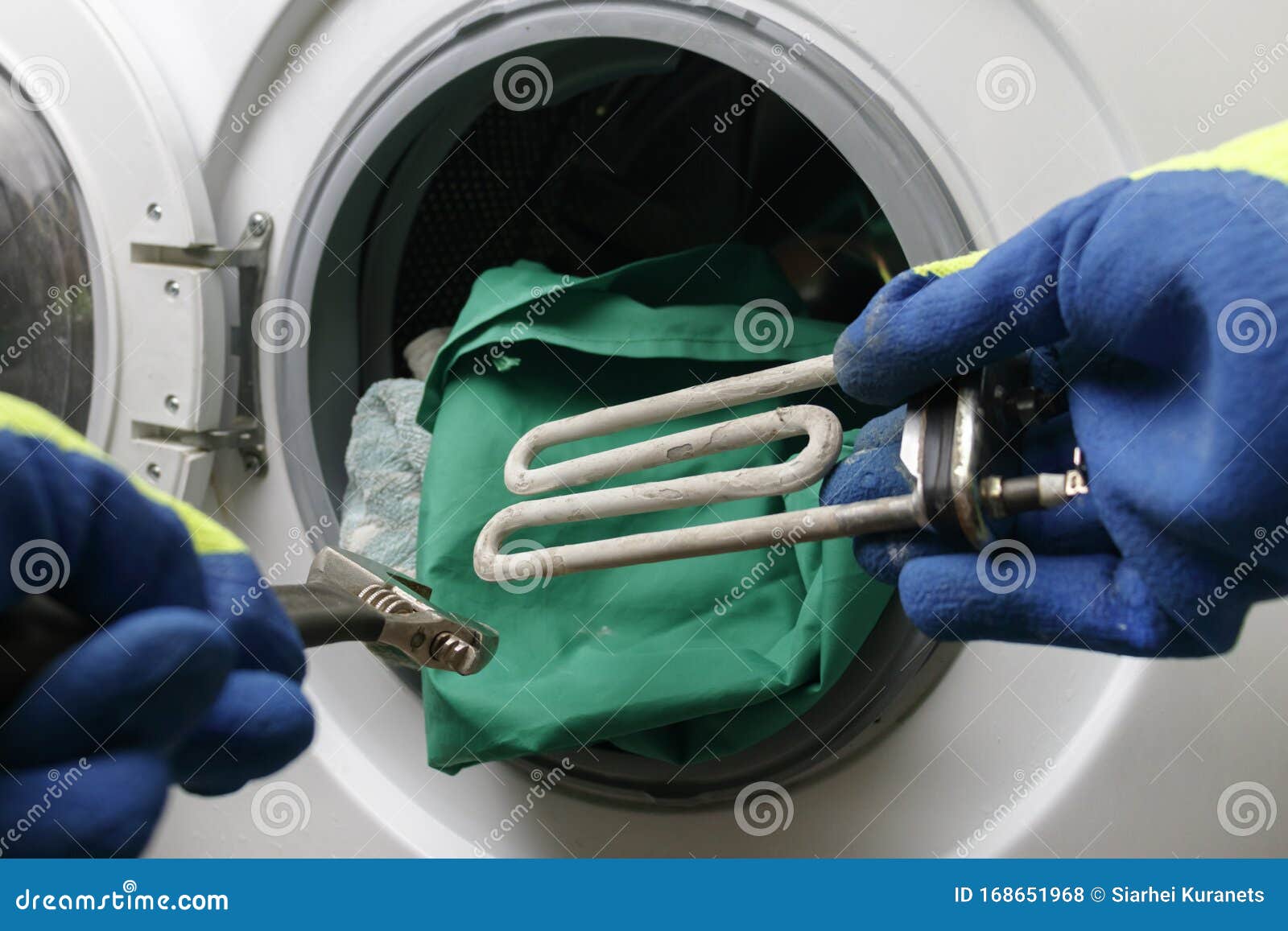 Washing Machine Breakdown. the Master Retrieves the Floor Part. in the ...