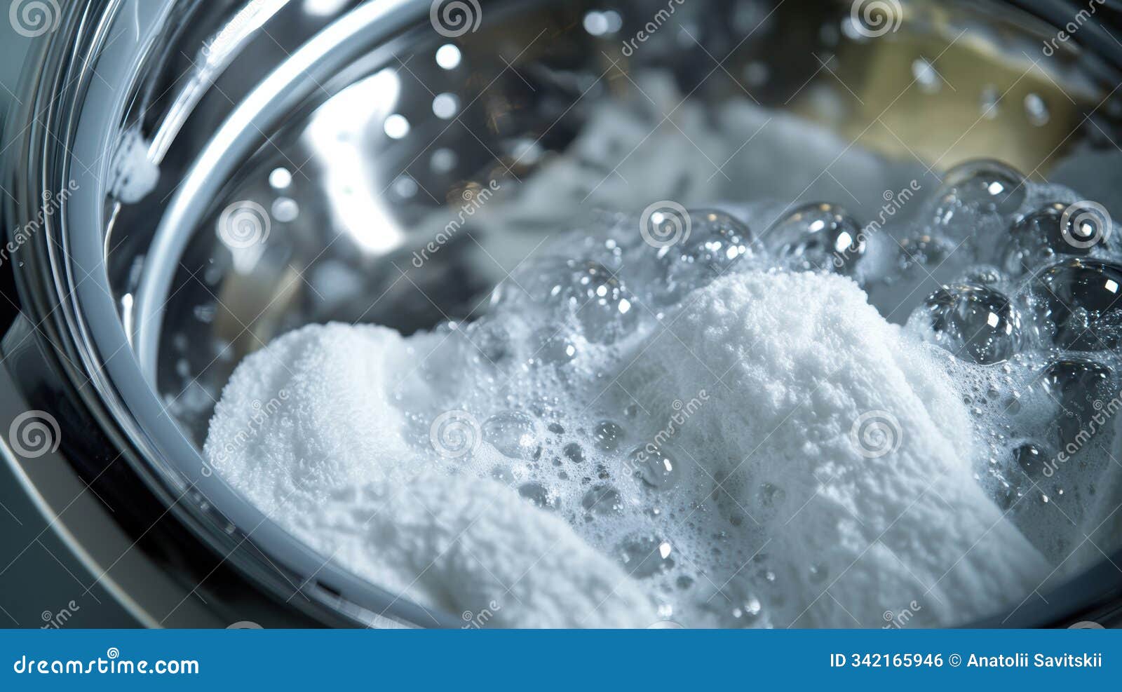 The Washing Machine Drum is Filled with White Towels Soaking in Soap ...