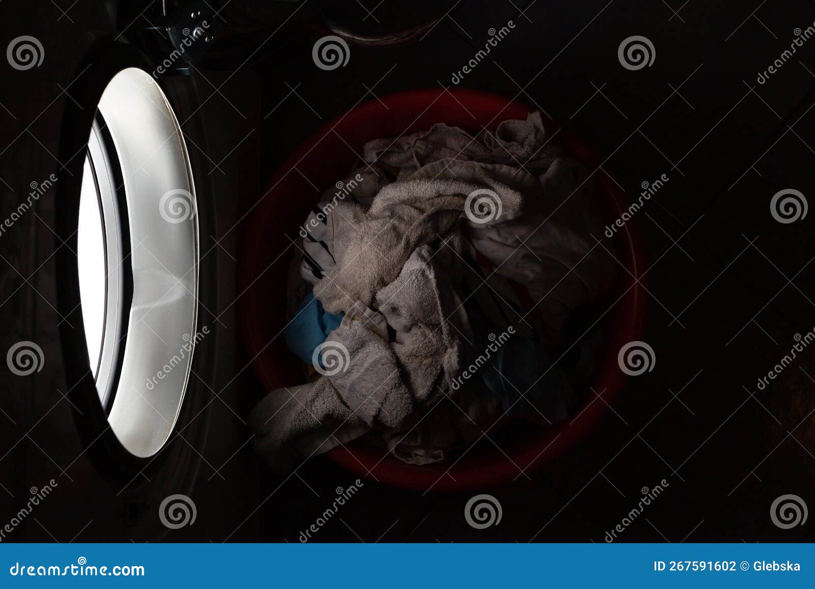 Washing Machine Glows from Inside in a Dark Laundry Room Stock Photo ...