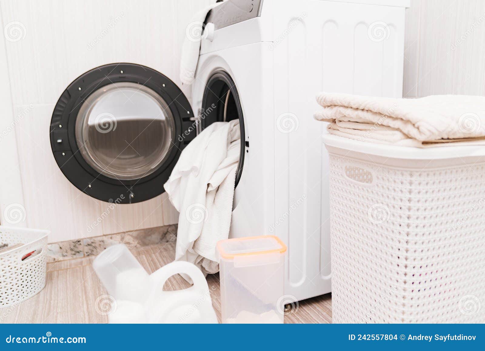 Washing Machine with Linen Inside in the Bathroom or Laundry Room ...