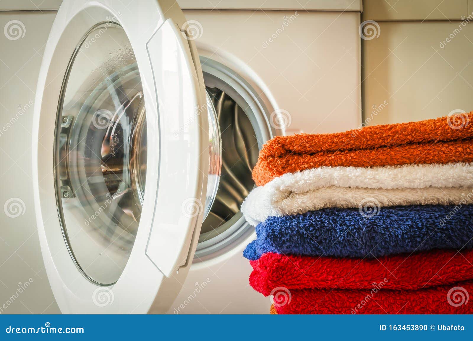 Washing machine and towels stock photo. Image of laundry - 163453890