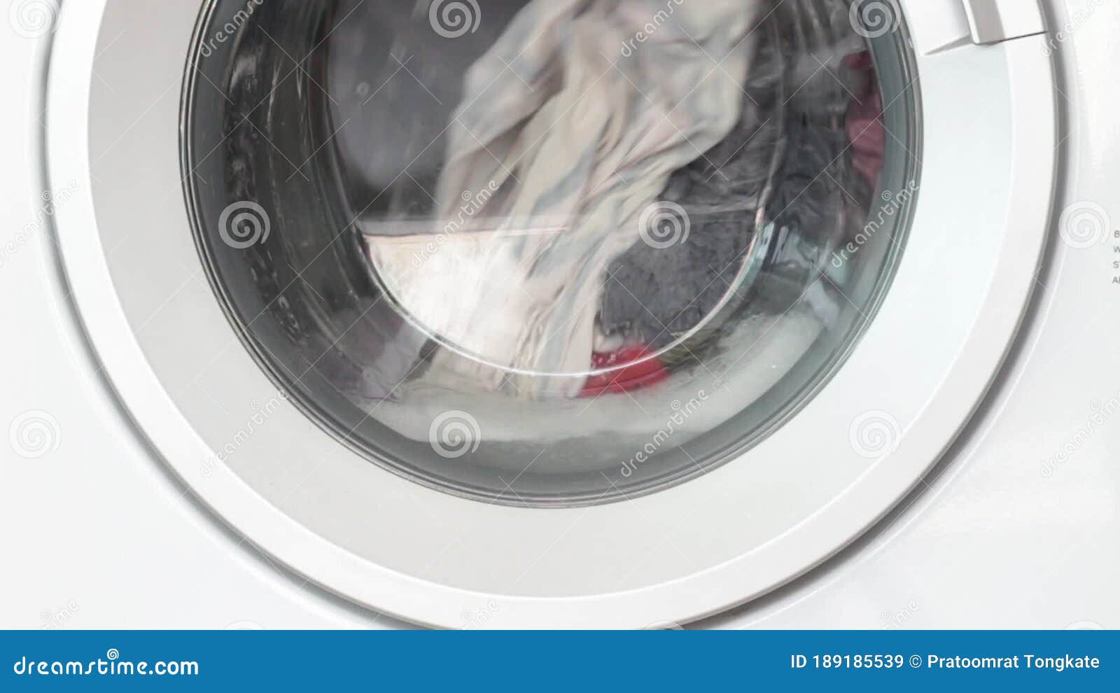 Washing Machine Working with Rotating Garments Inside, Process of ...