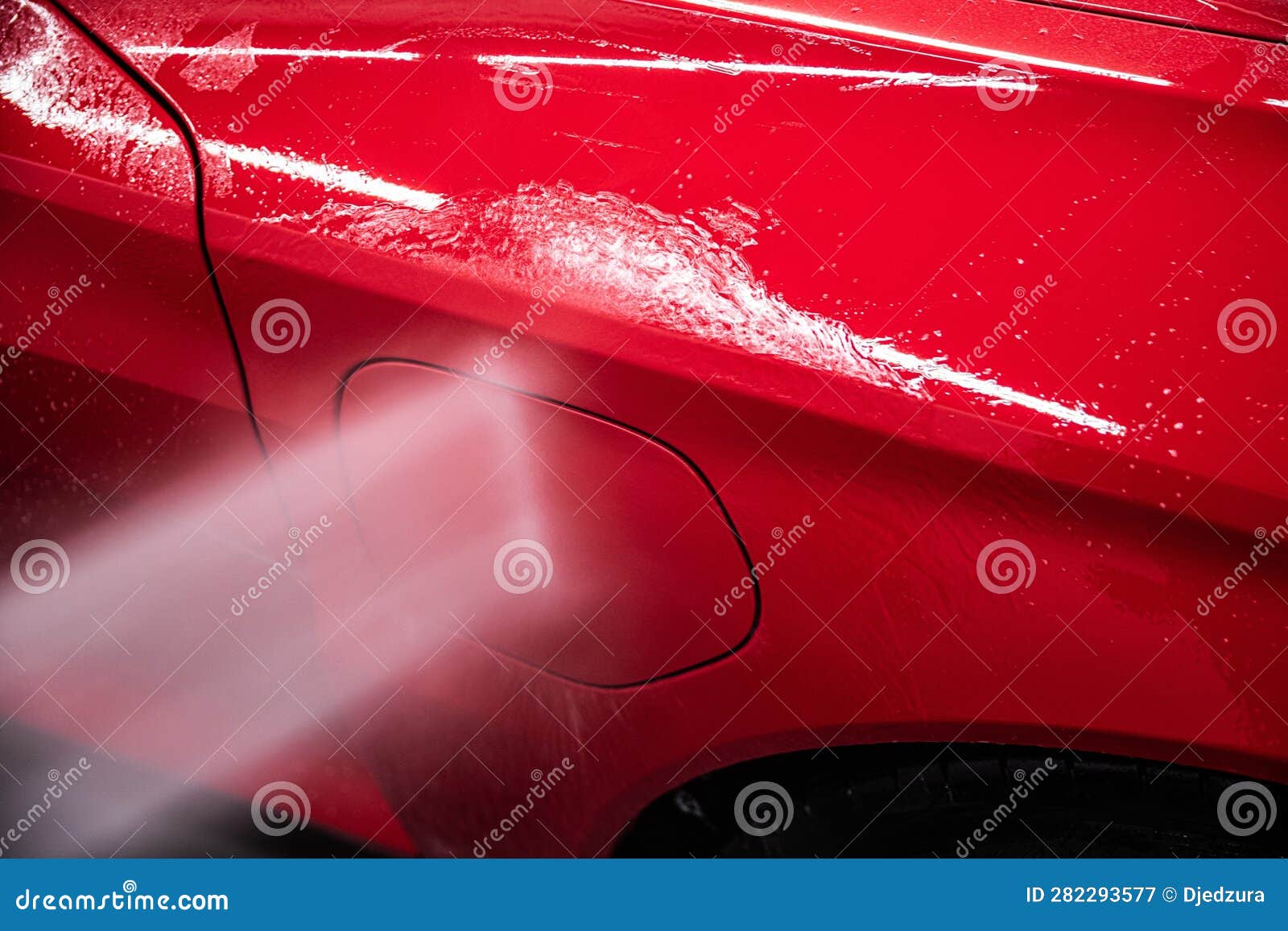 Washing a Modern Red Car at a Car Wash Using a Pressure Washer Stock ...
