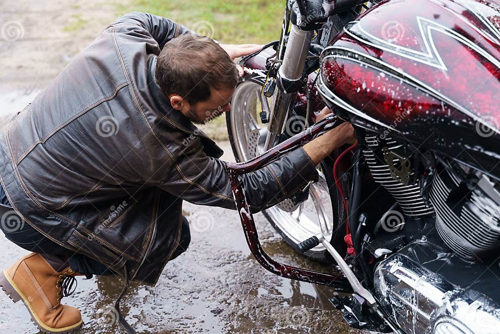 Washing a Motorcycle Engine with a Detergent Using a Sponge. Stock ...