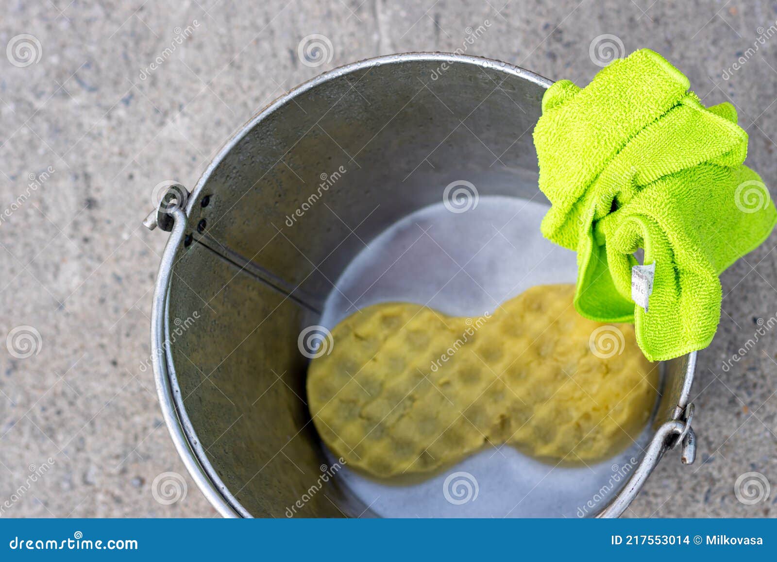 A Washing Sponge with a Cloth in a Bucket Stock Photo - Image of view ...