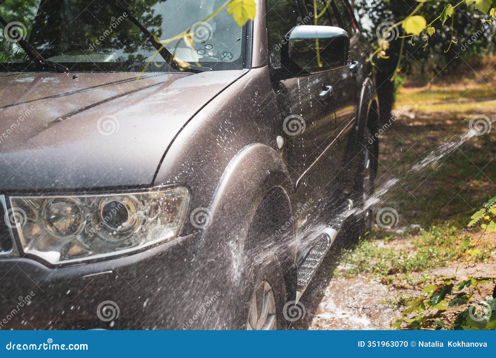 Washing Your SUV Car with a Hose at Home in Your Backyard Stock Photo ...