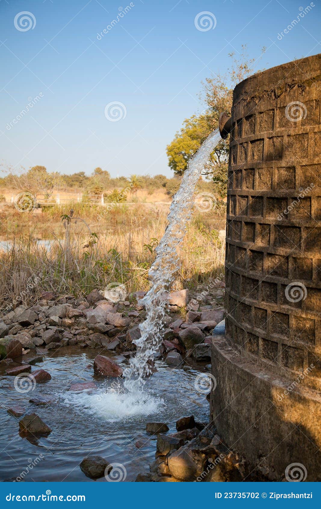 Wastage of water by tank stock photo. Image of falling - 23735702
