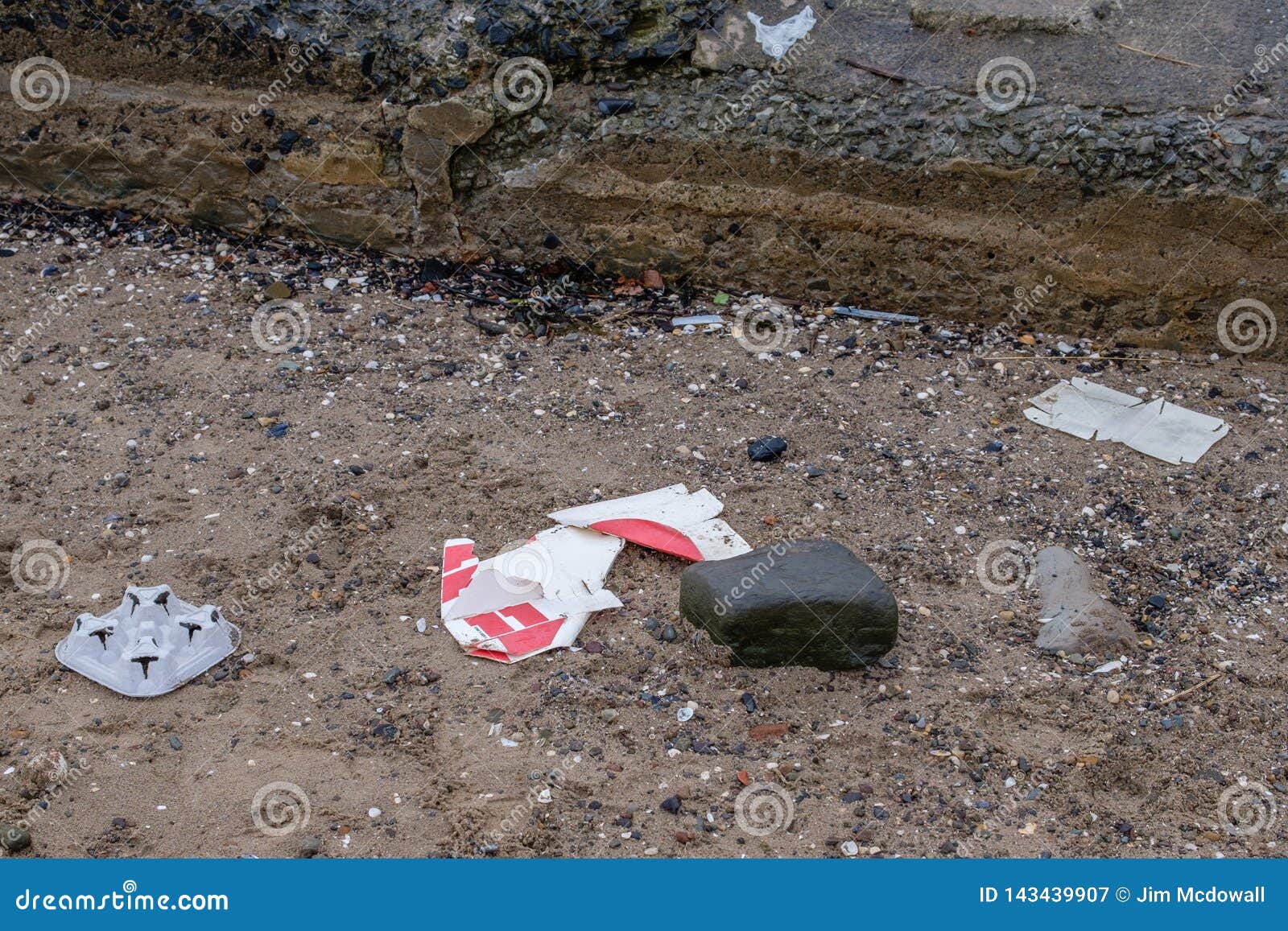 Waste Being Discarded on the Beach with Cardboard and Plastic Being ...