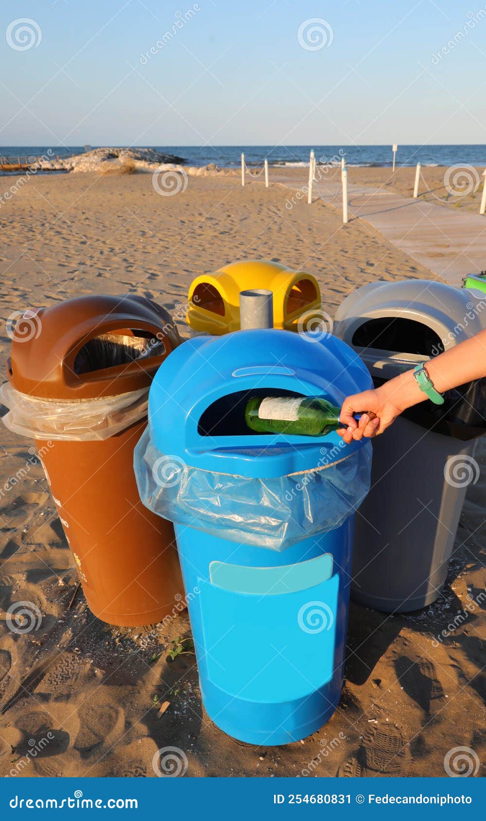 Waste Bin for Separate Collection on the Beaches and a Hand Stock Image ...
