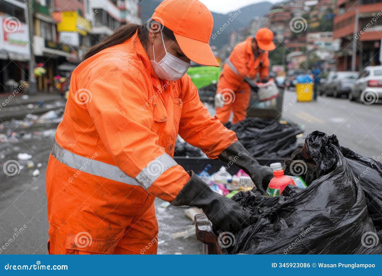 Waste Management Workers Cleaning and Sorting Trash in Urban ...