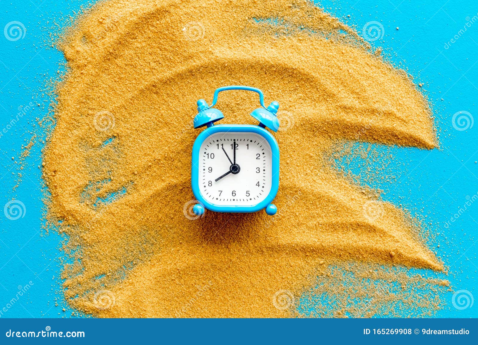 Waste of Time Concept. Clock on Sand on Blue Background Top-down Stock ...