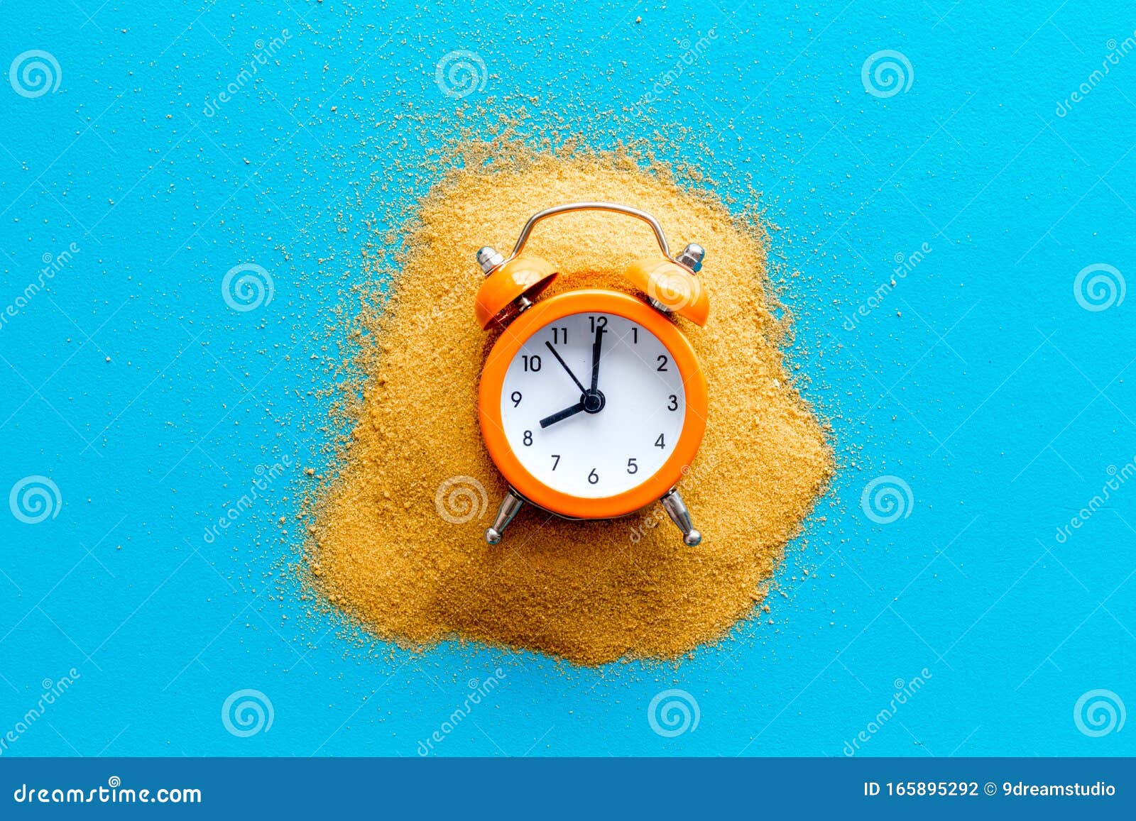 Waste of Time Concept. Clock on Sand on Blue Background Top-down Copy ...