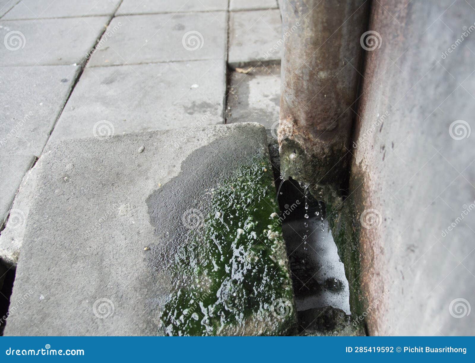 The Waste Water that Flows from the Pipe Onto the Footpath Next To the ...