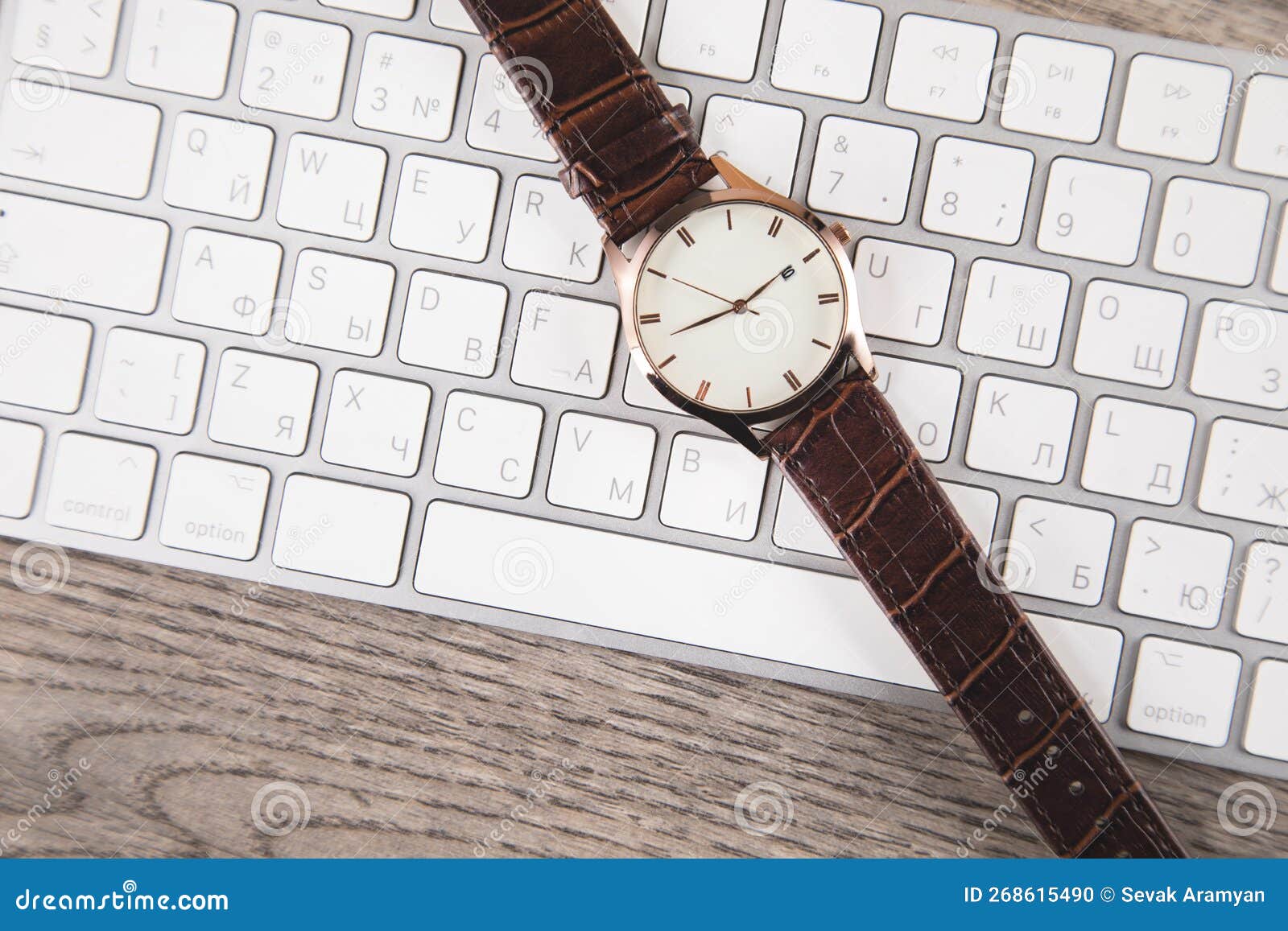 Watch on computer keyboard stock photo. Image of concept - 268615490