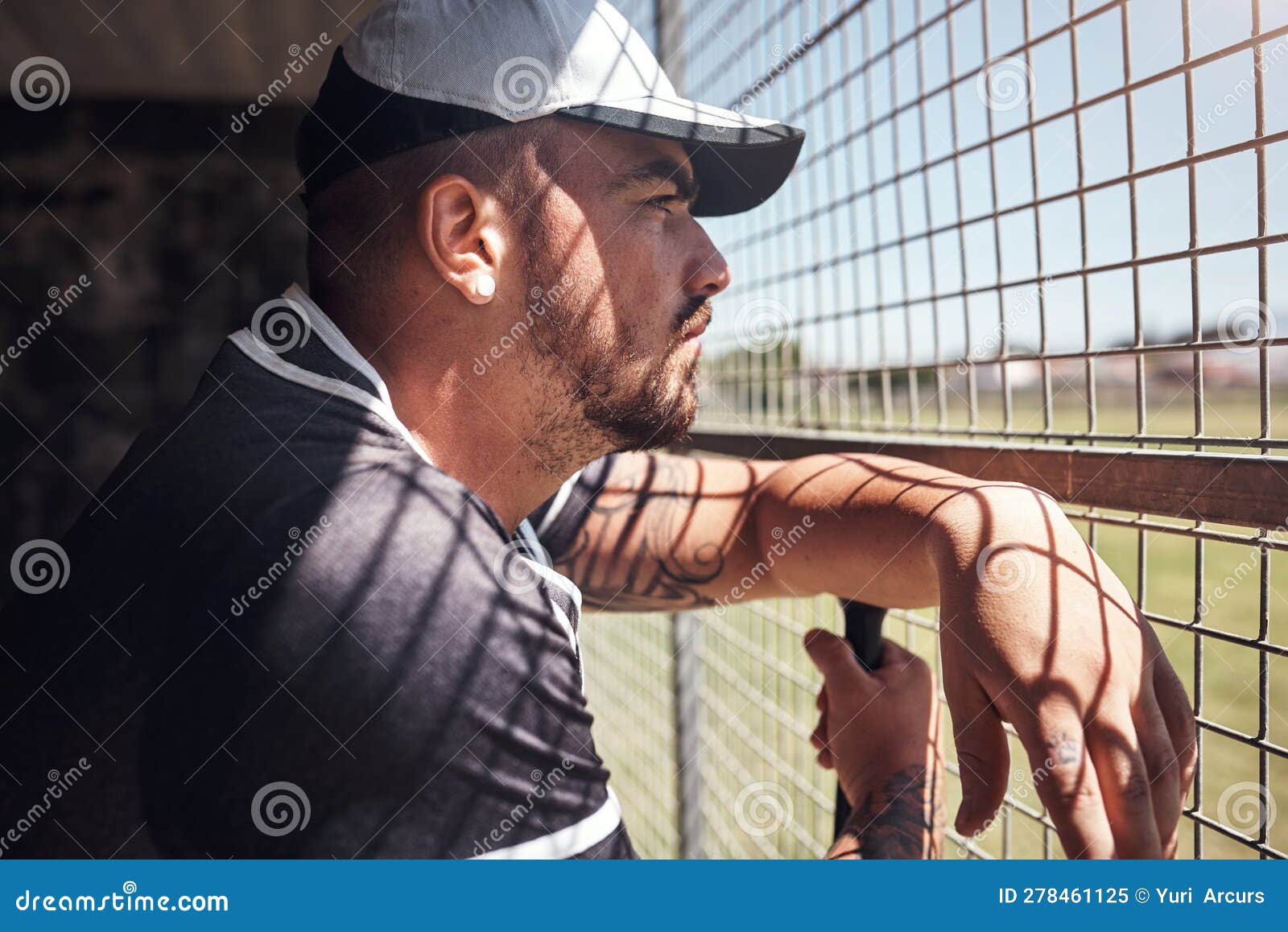 When we Watch, we Learn. a Young Man Watching a Game of Baseball from ...