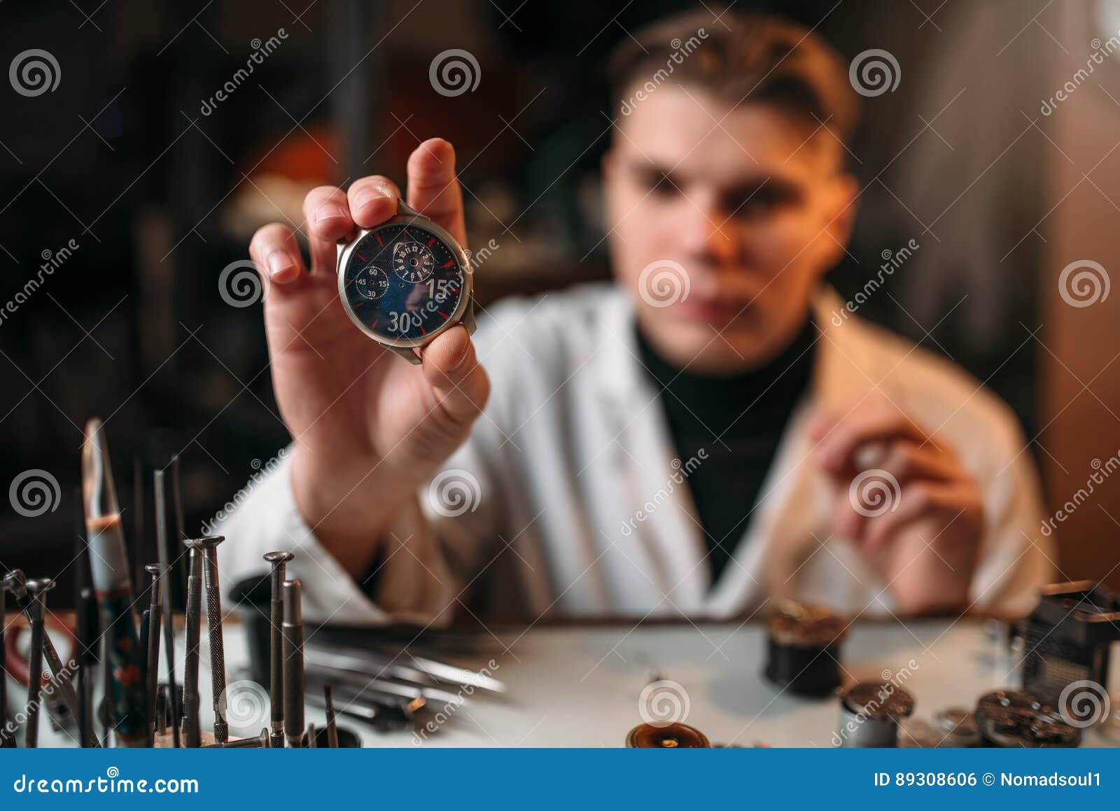 Watch Maker Holding Wrist Watch in Hand Stock Photo - Image of antique ...