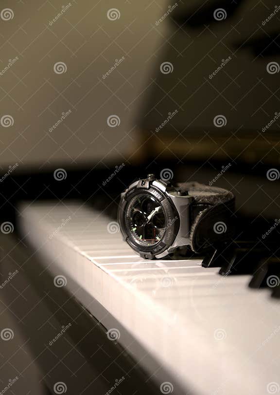 Watch on piano stock image. Image of watch, misic, time - 12930663