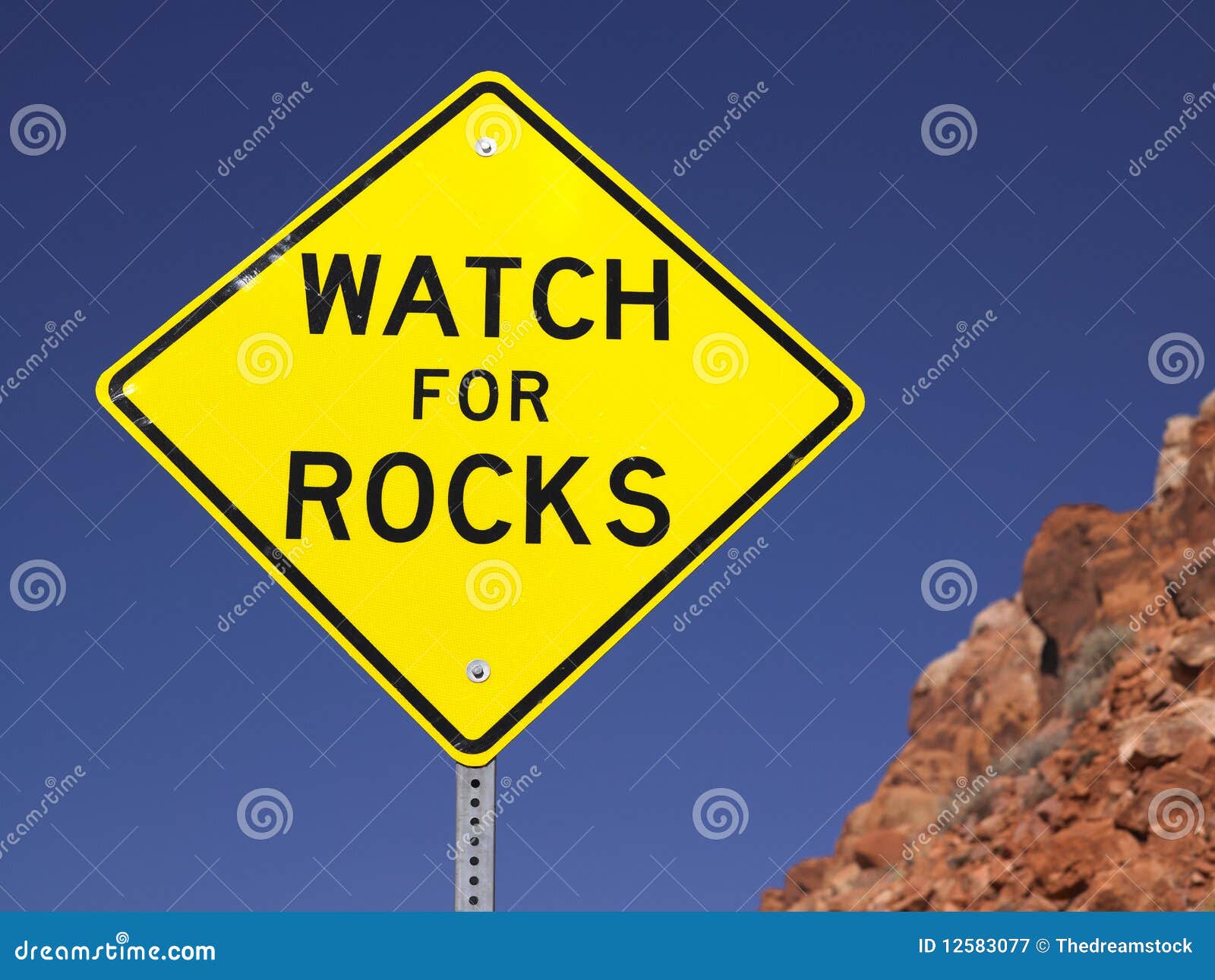 Watch for Rocks Sign Next To Highway Stock Image - Image of sunny ...