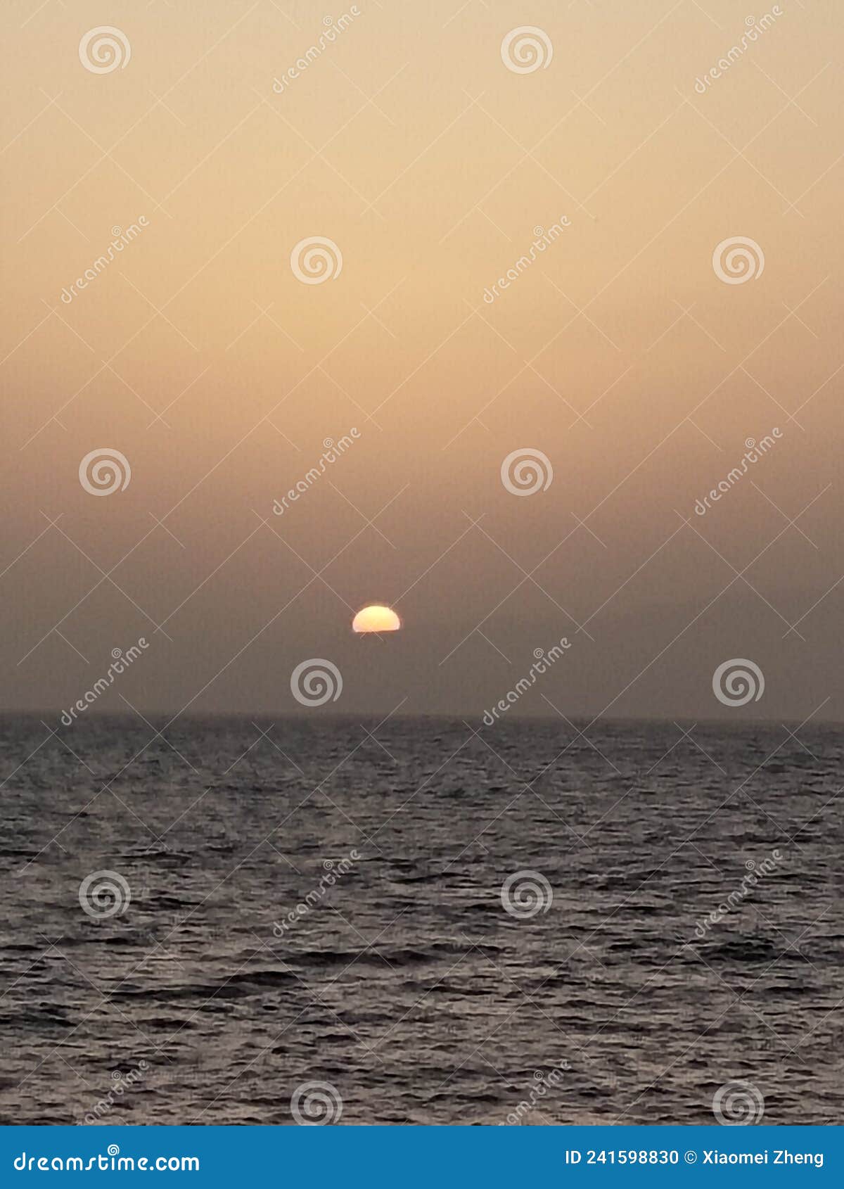 Watch the sunset beache stock photo. Image of dawn, wave - 241598830