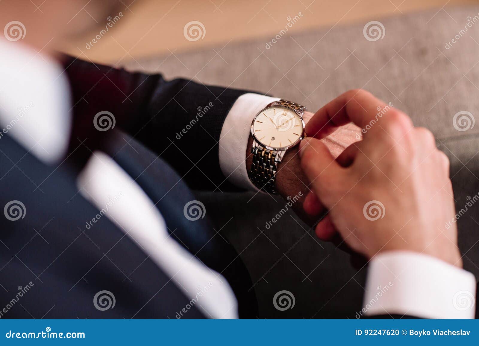Watch with White Dial on the Hand of a Man in a White Shirt Stock Photo ...
