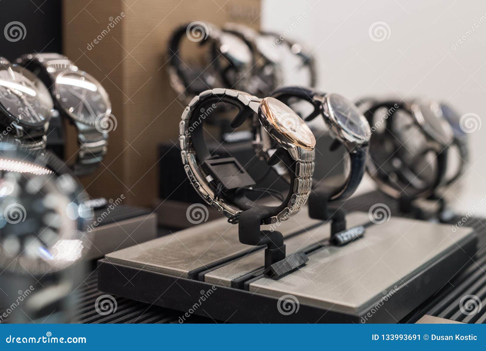Watches in a luxury store stock image. Image of comercial - 133993691