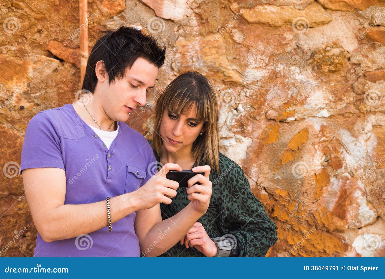 Watching the phone stock image. Image of smartphone, standing - 38649791