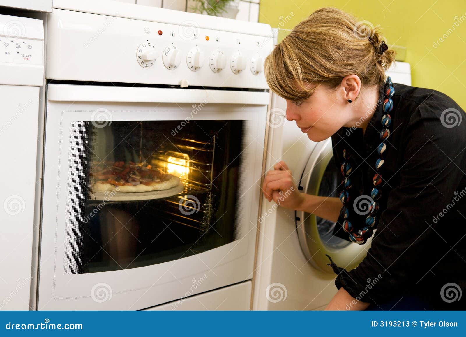 Watching Pizza Bake stock image. Image of stove, home - 3193213