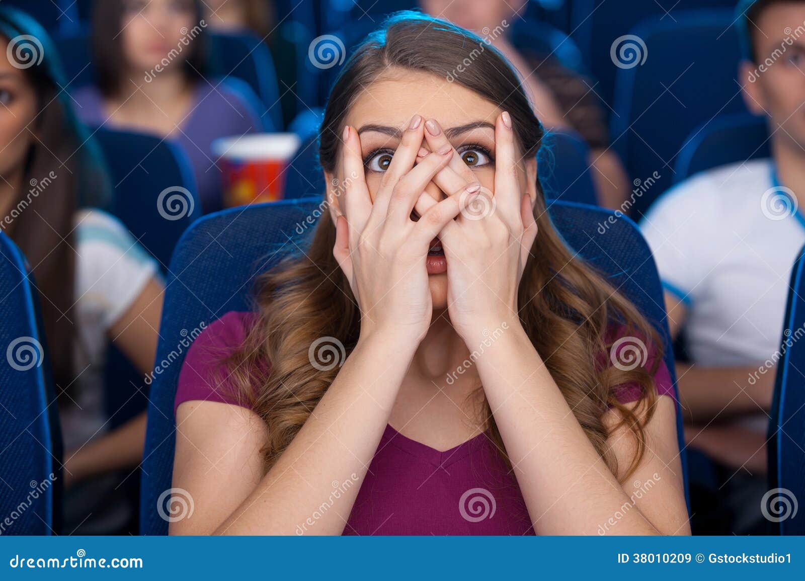 Watching a scary movie. stock image. Image of group, entertainment ...