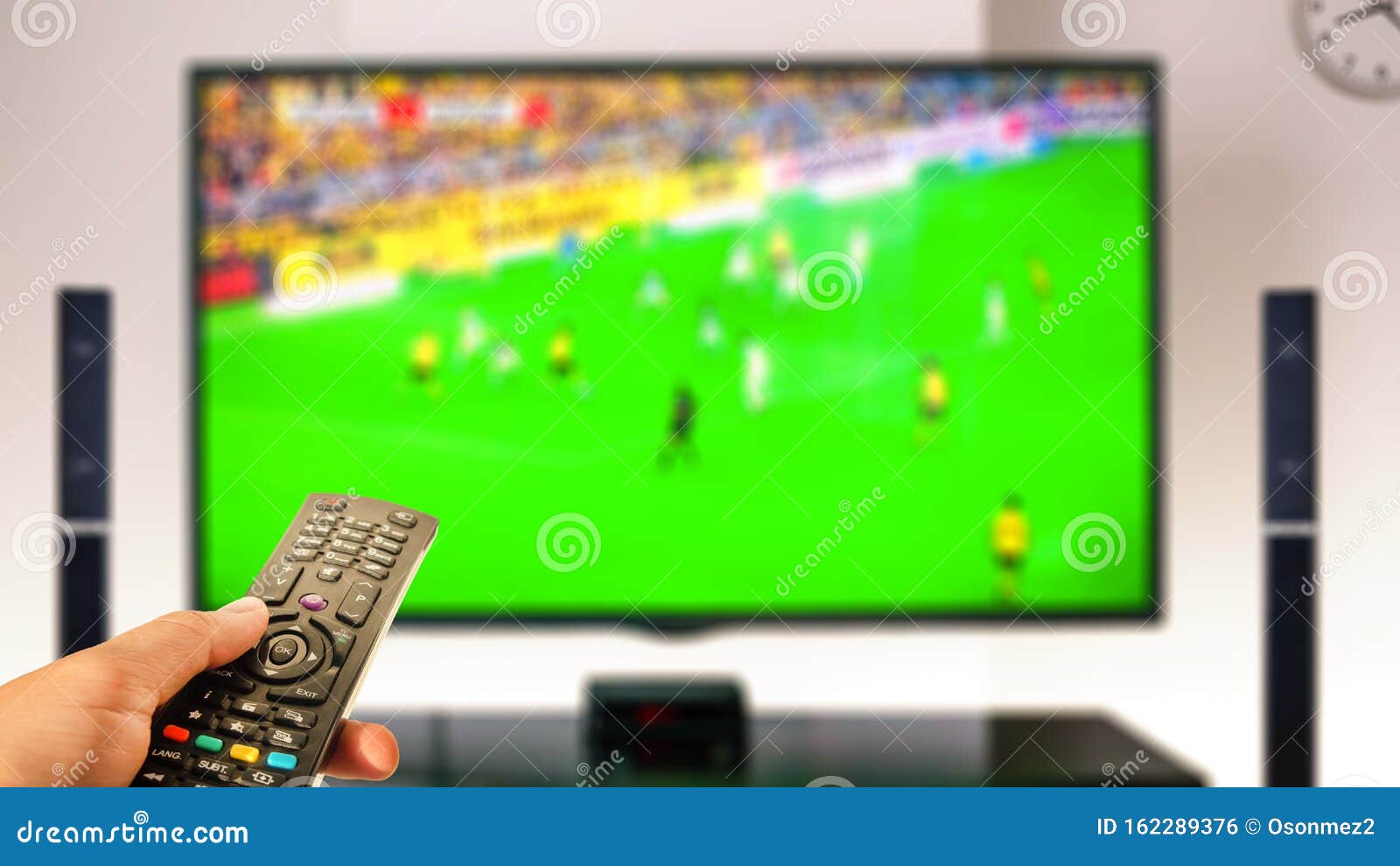 Watching Soccer at Home Tv with Remote Control on Hand Stock Photo ...