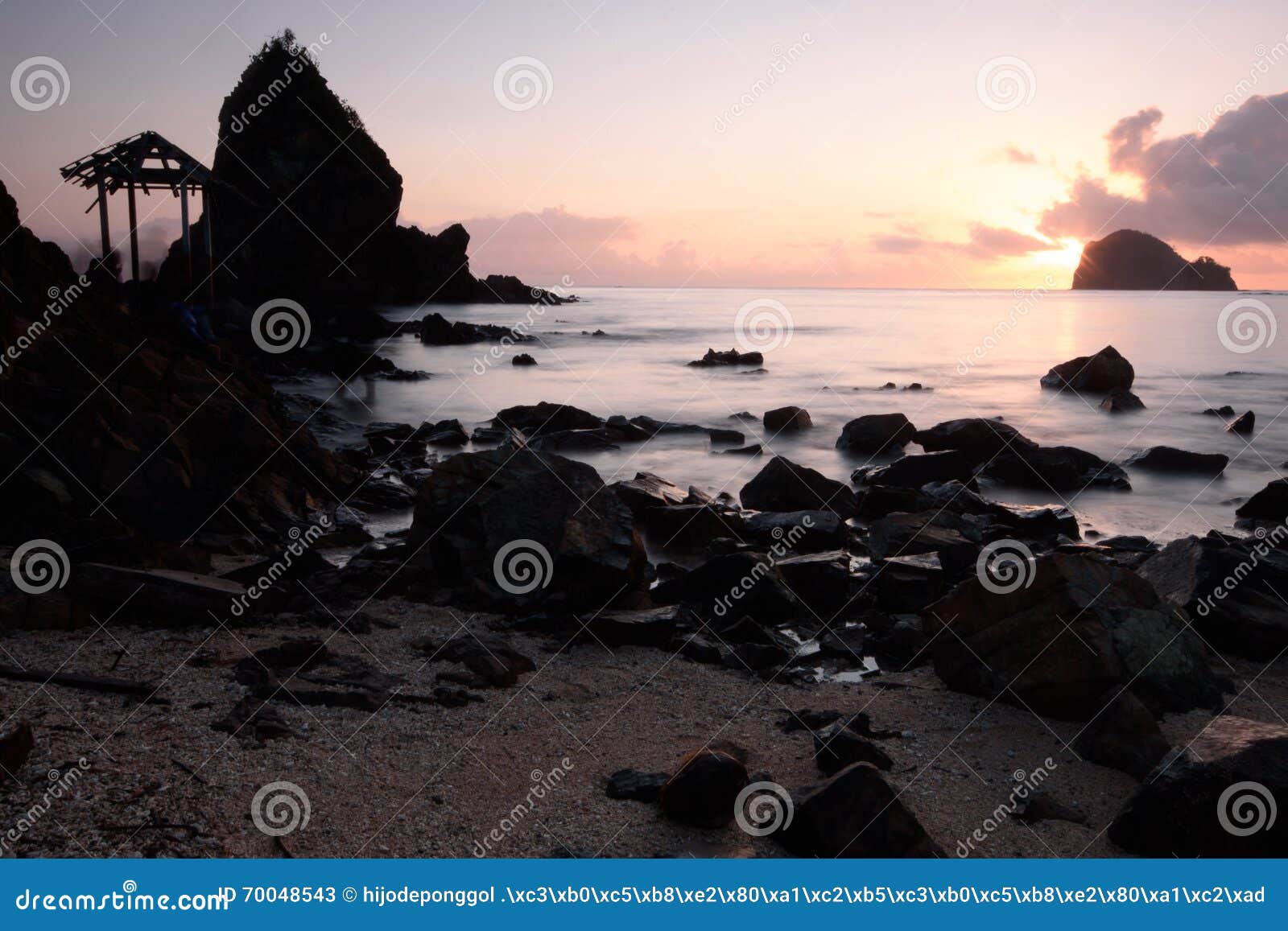Watching Sunrise and Rock Formation at the Shore Stock Image - Image of ...