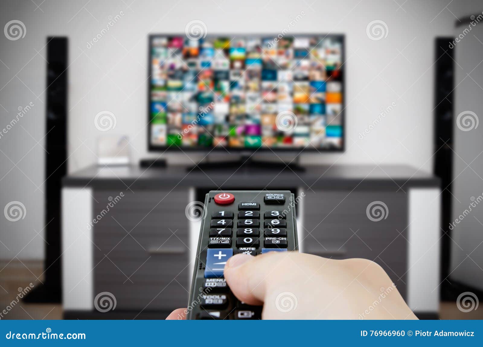 Watching Television in Modern TV Room. Hand Holding Remote Stock Photo ...