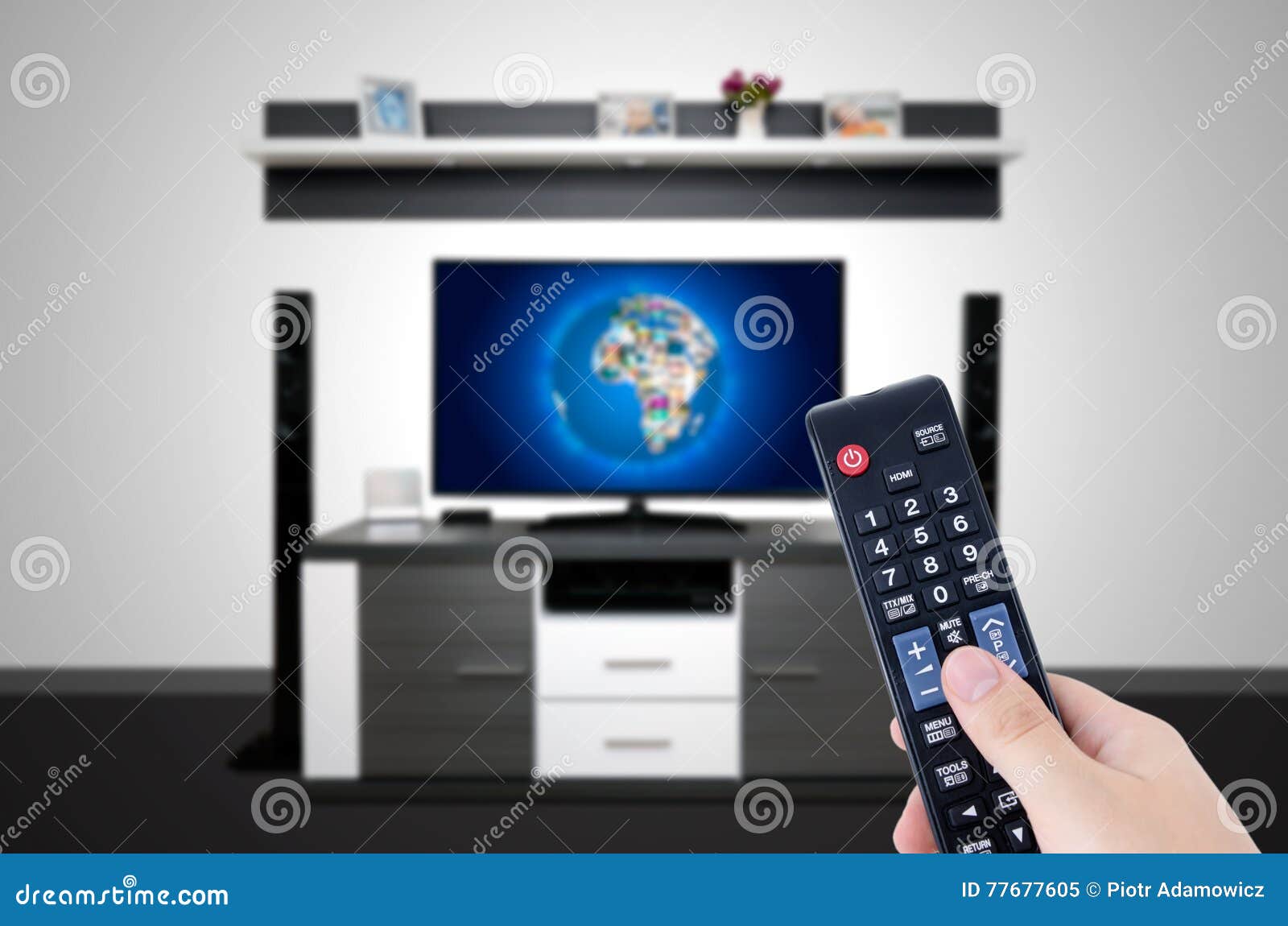 Watching Television in Modern TV Room. Hand Holding Remote Stock Image ...