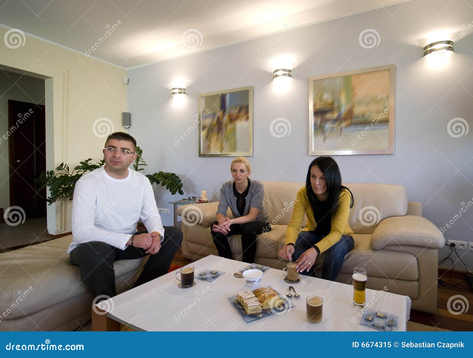 Watching TV together stock image. Image of friends, interior - 6674315