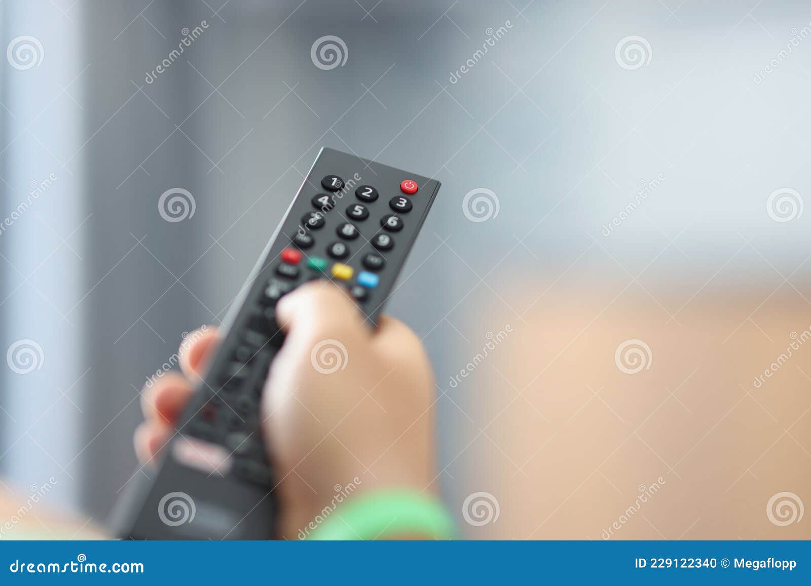 Watching TV and Using the Remote Control Closeup Stock Photo - Image of ...