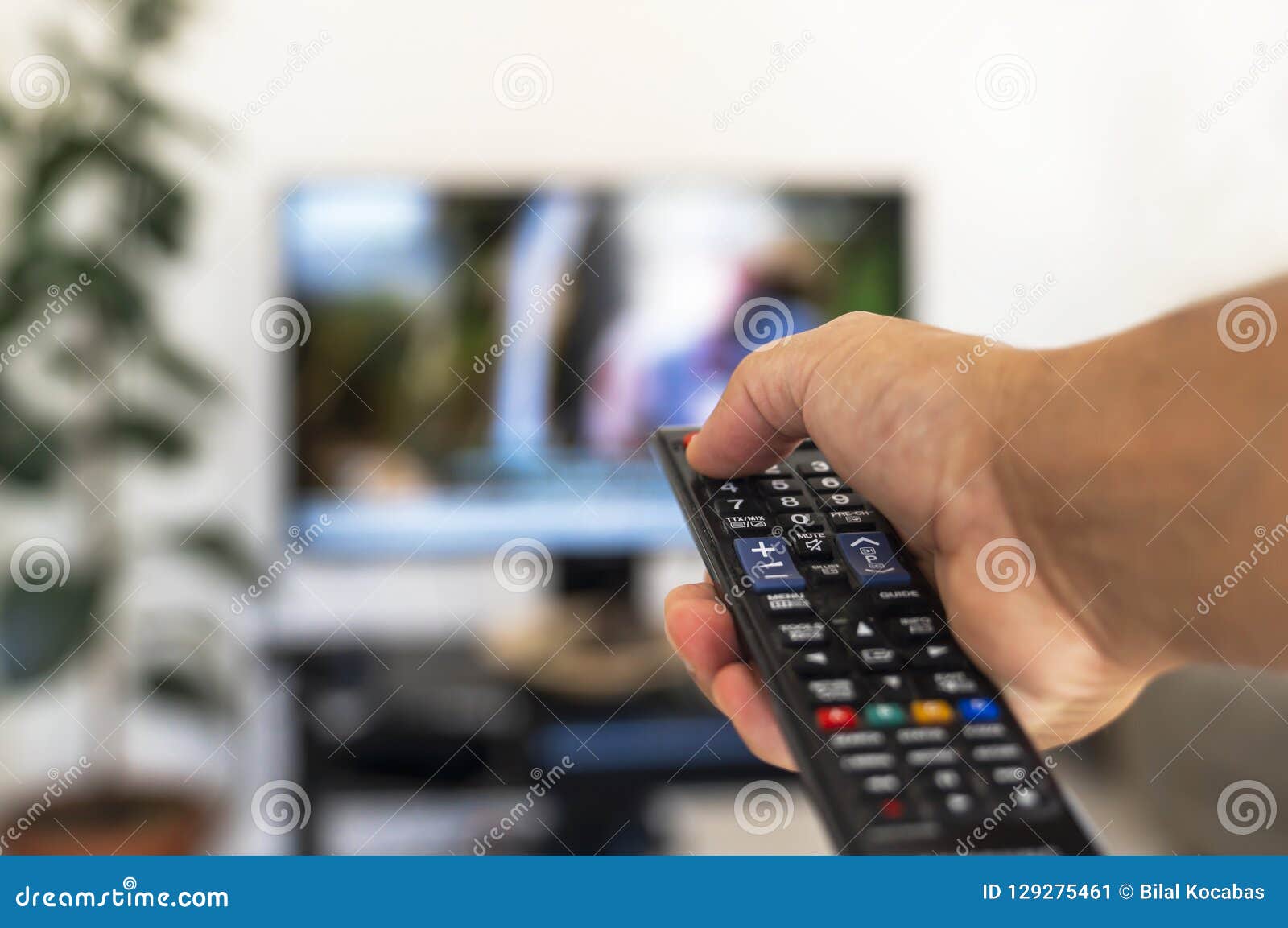 Watching Tv and Using Remote Control Stock Image - Image of internet ...