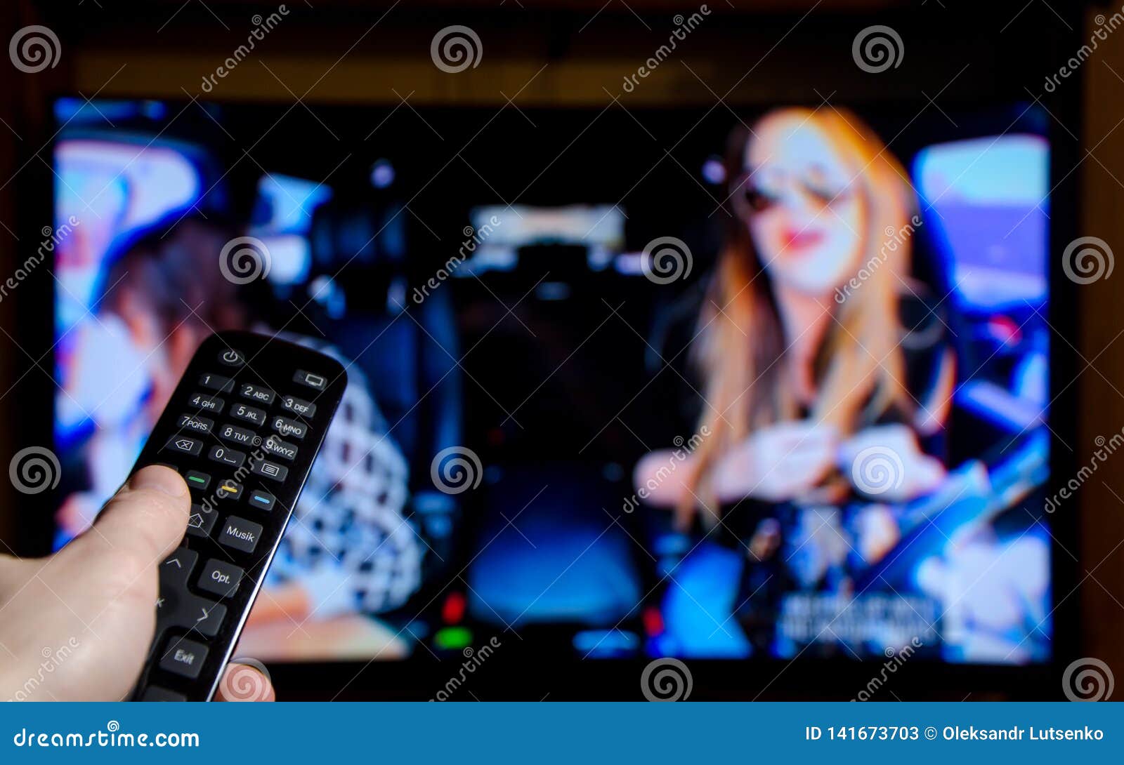 Watching TV and Using Remote Controller Stock Image - Image of ...