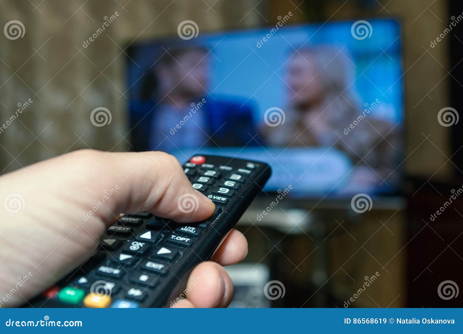 Watching TV and Using Remote Controller Stock Image - Image of hold ...