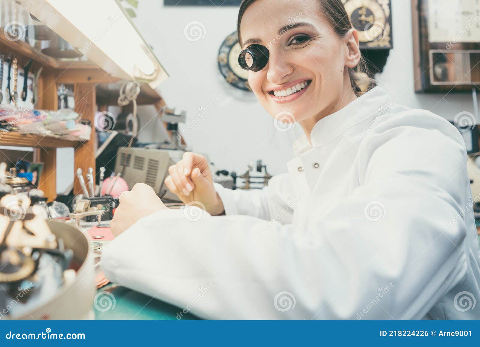 Watchmaker Woman Looking at Camera in Her Workshop Stock Photo - Image ...