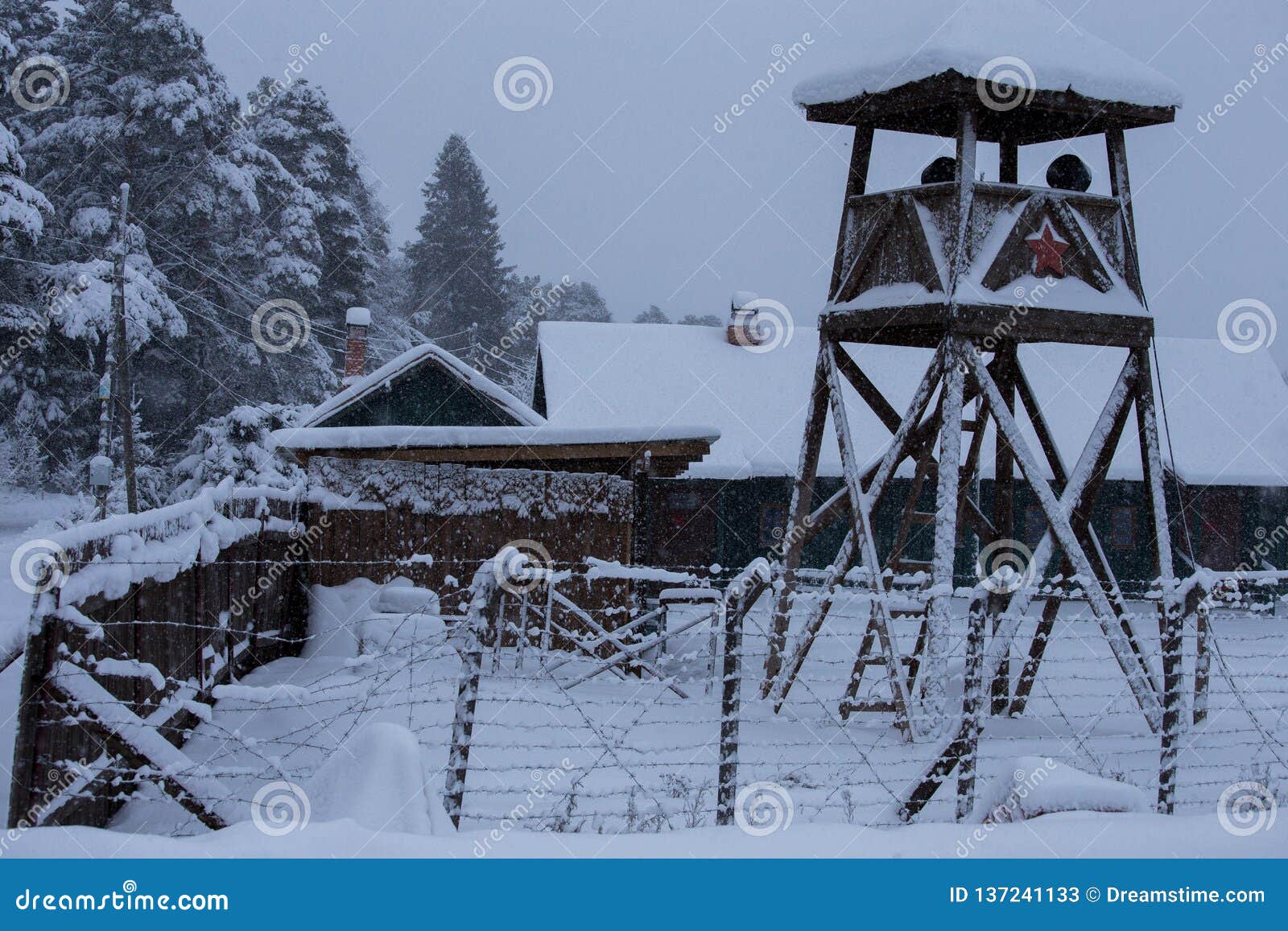 A Watchtower with the Fence in the Middle of the Snow Covered Forest ...