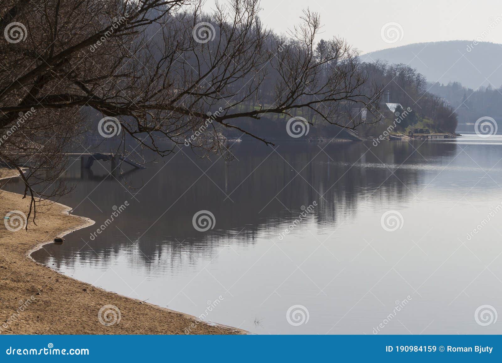 Water Area of the Dam with a Sandy Shore Line. a Concrete Pier Leads ...