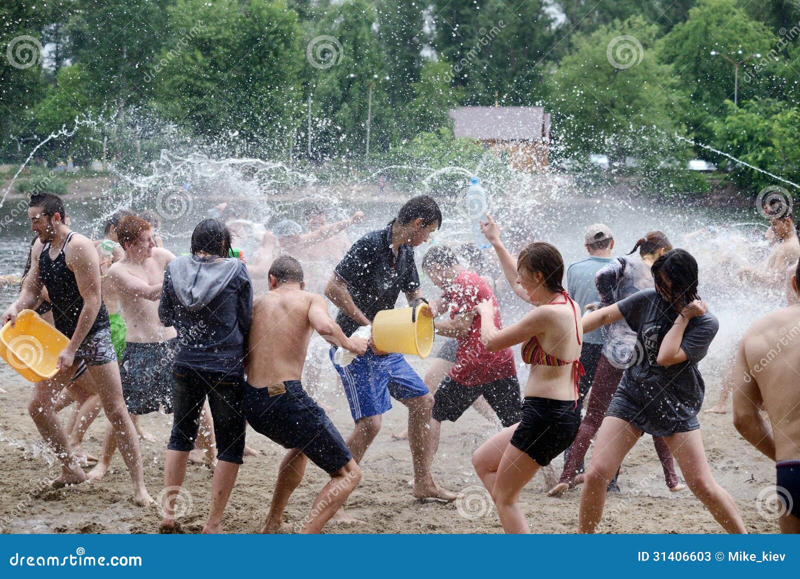 Water battle on Kiev beach editorial stock photo. Image of woman - 31406603