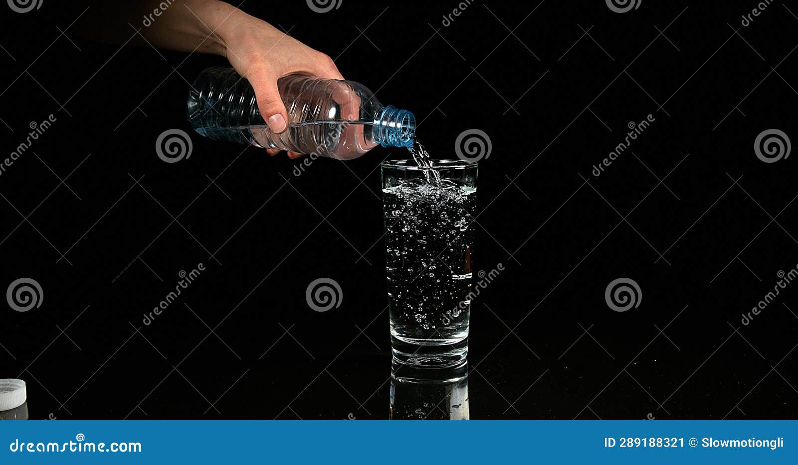Water Being Poured into Glass Against Black Background Stock Image ...