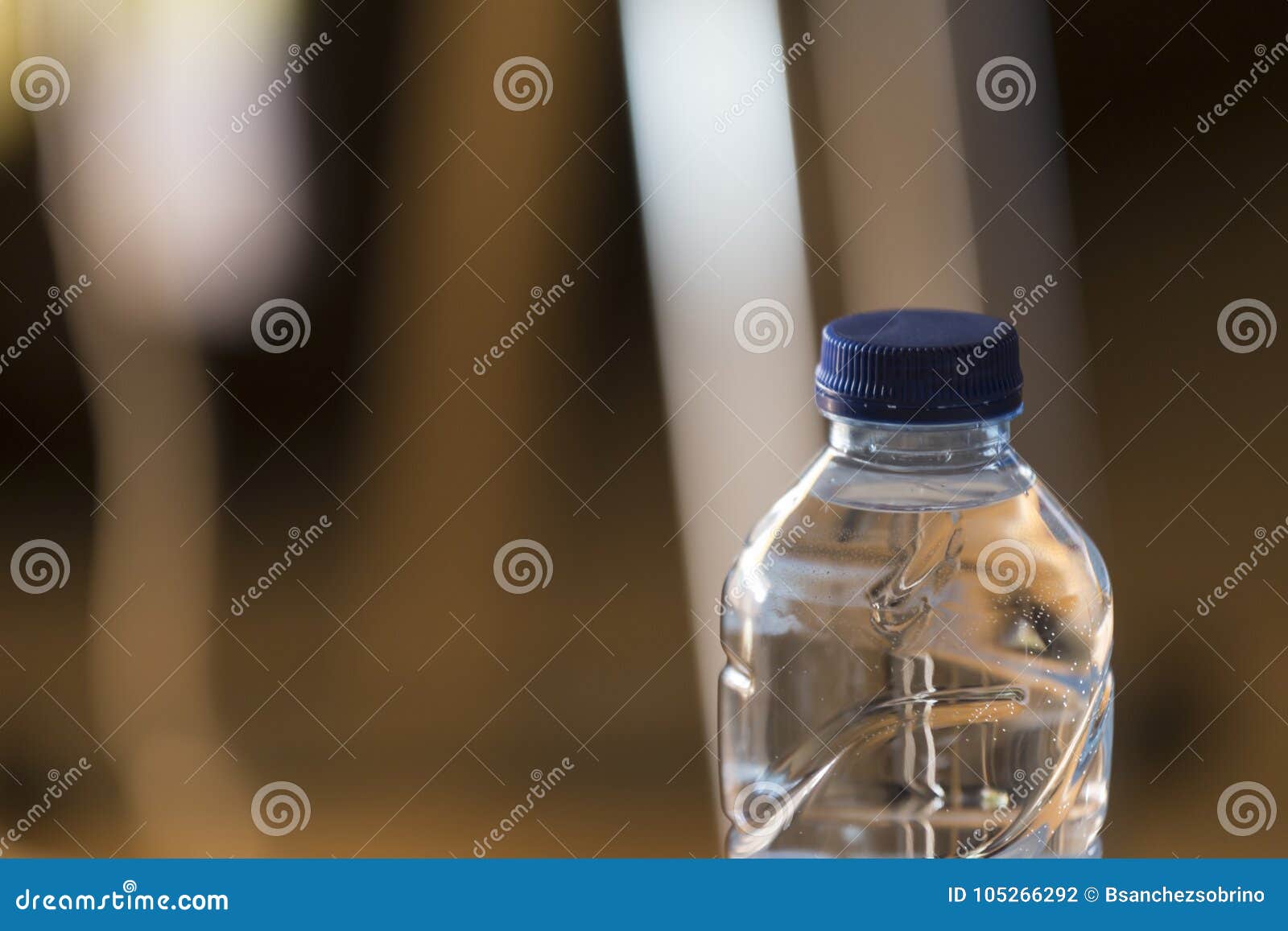 Water bottle with blue cap stock photo. Image of transparent - 105266292